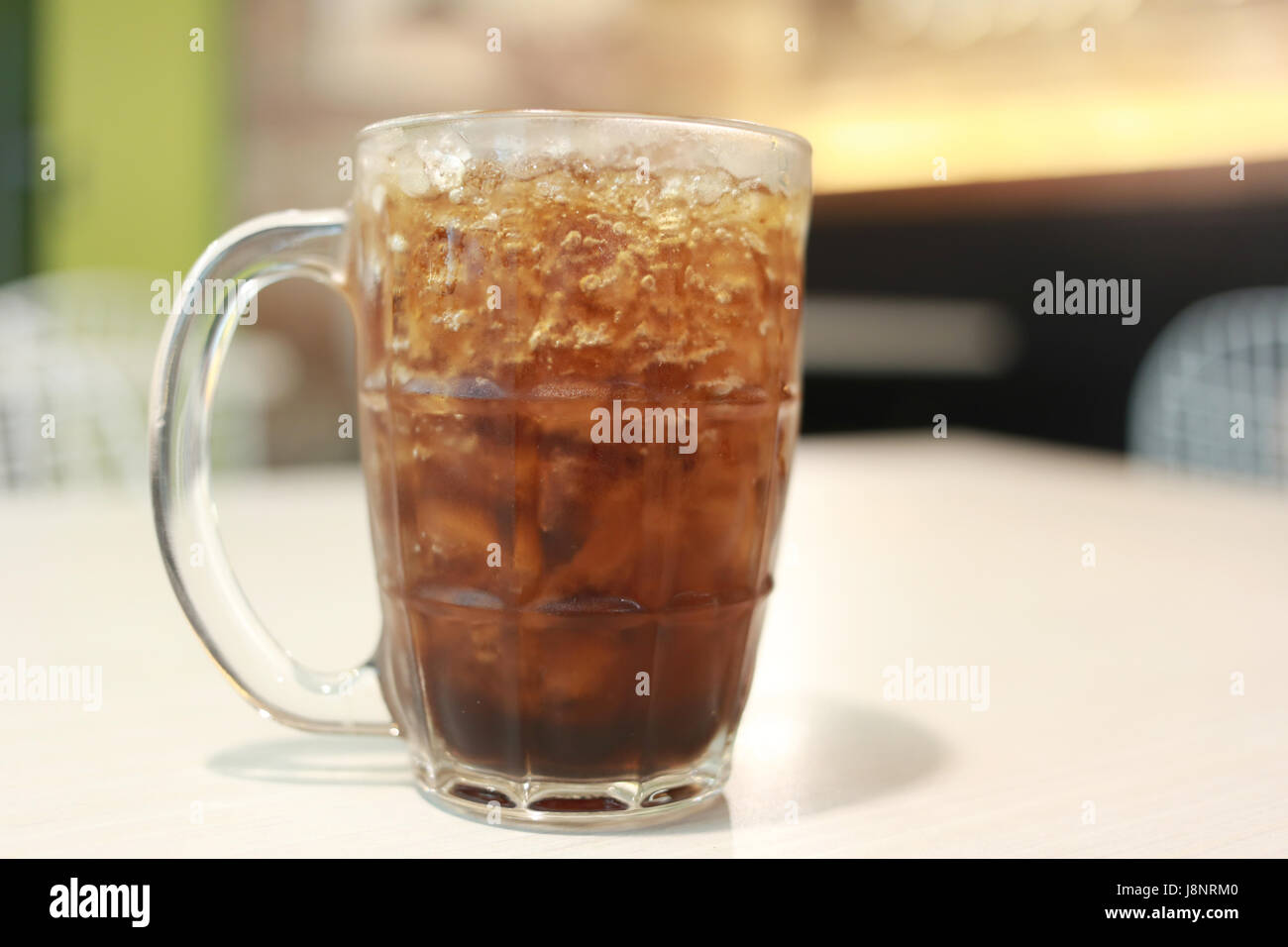Coca Cola glass on the food table in the restaurant Stock Photo - Alamy