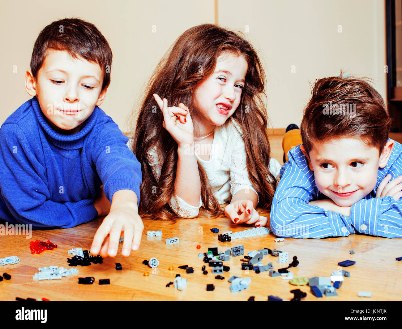 funny cute children playing toys at home, boys and girl smiling Stock ...