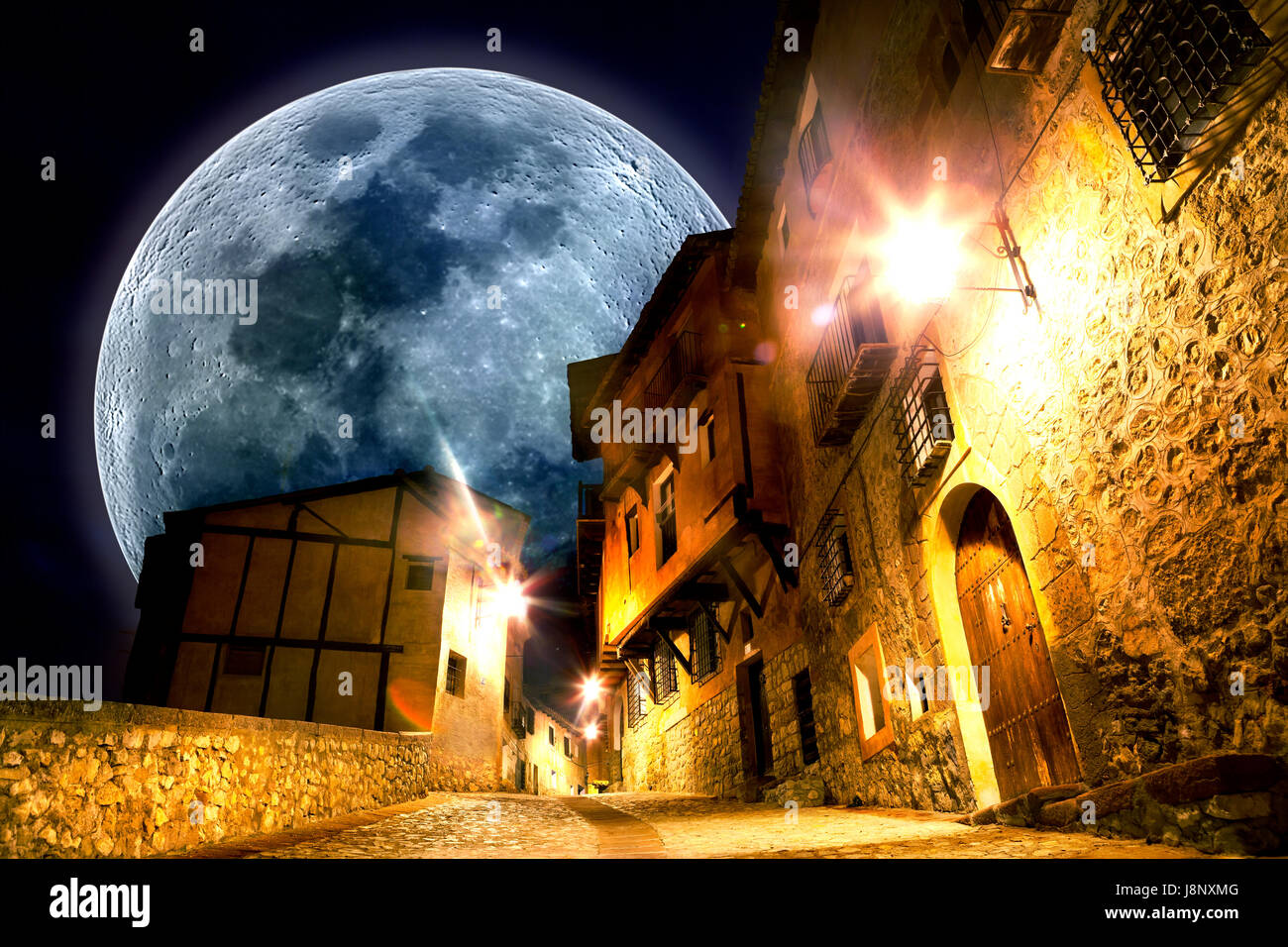 Dreamscape full moon cityscape and street and lamppost Stock Photo - Alamy