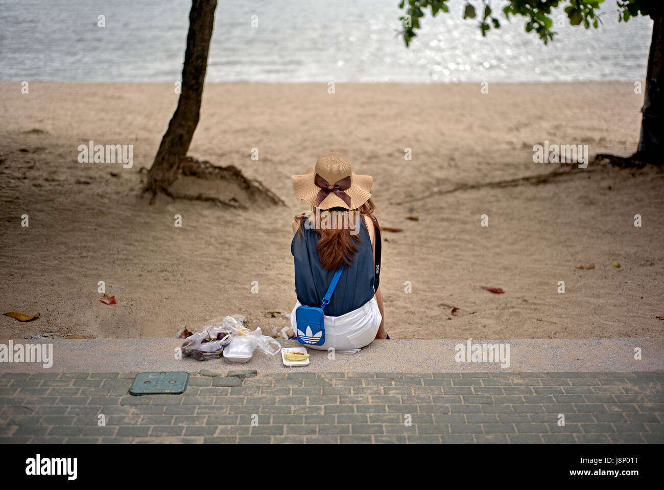 Woman rear view outside alone hi-res stock photography and images - Alamy