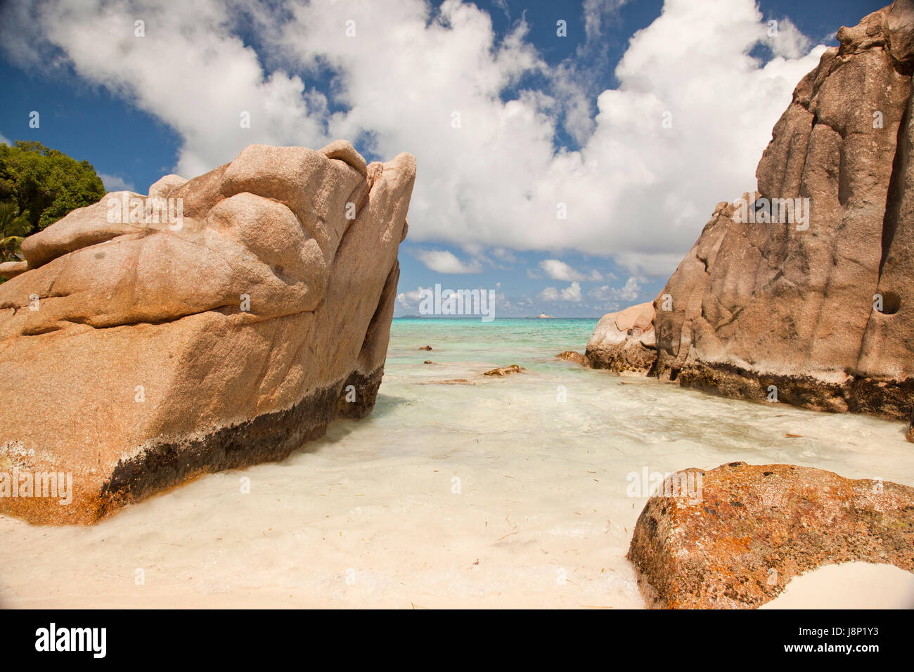 tropical beach with rocks Stock Photo - Alamy
