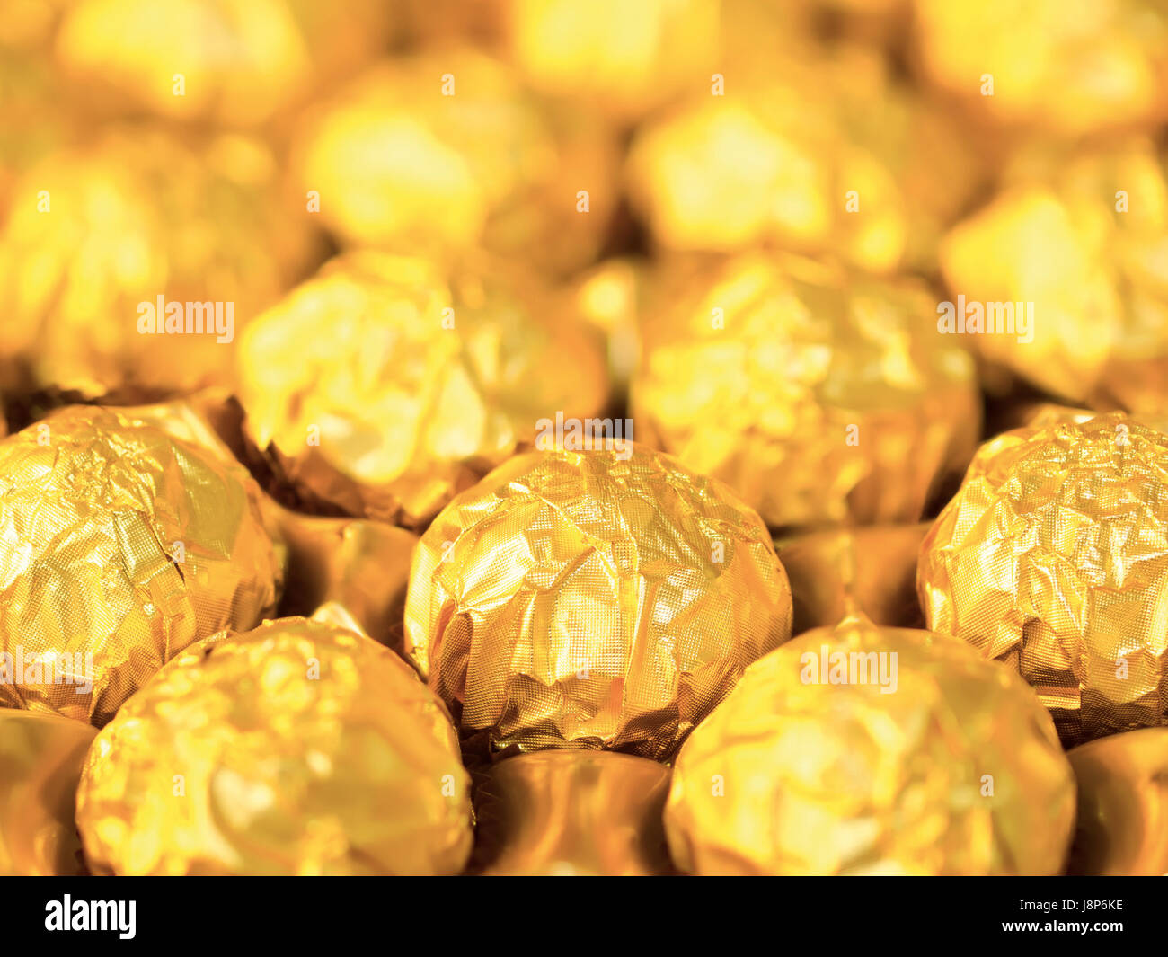 Gold wrapper wrappers hi-res stock photography and images - Alamy