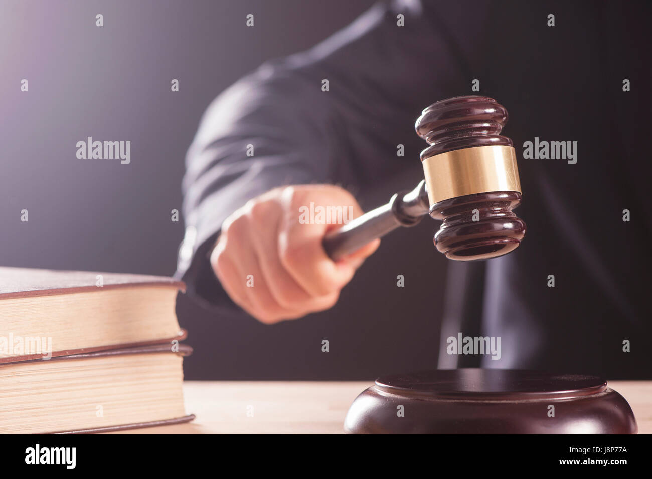 gavel in the hand of a man in a business suit Stock Photo - Alamy
