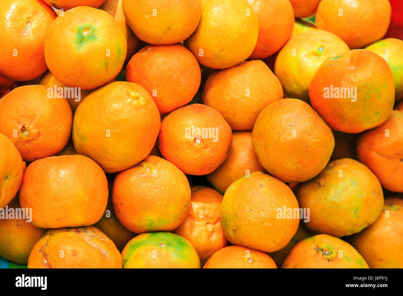 Mandarins in Indian market. Close-up fruit background Stock Photo - Alamy