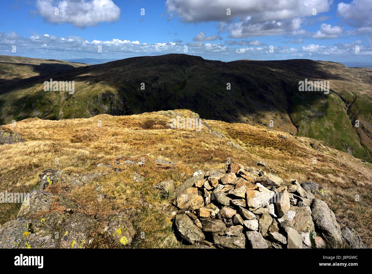 Shadows over Tarn Crag and Grey Crag Stock Photo - Alamy