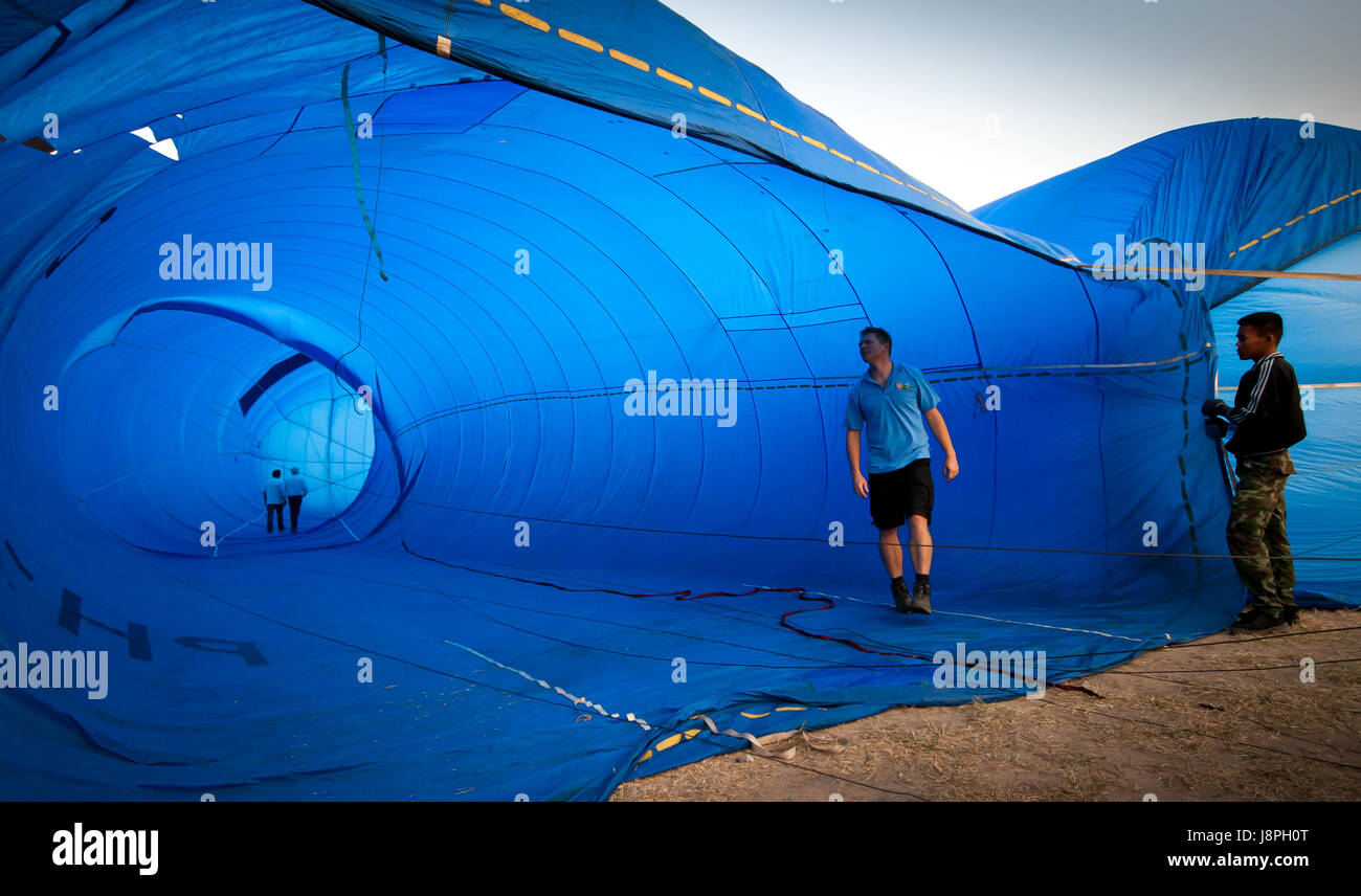 Inspector walk inside the balloon to check before take off in hot air ...