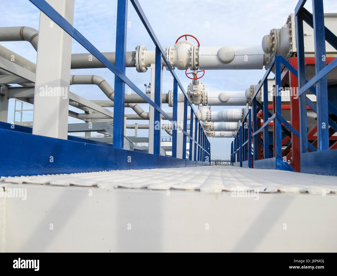 Steel service platform and stairs. Equipment refinery Stock Photo - Alamy