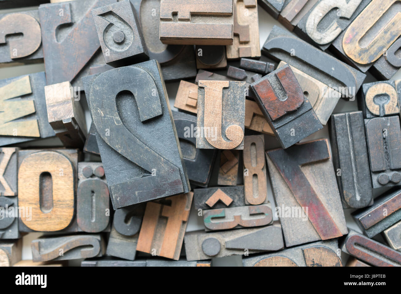 Old letterpress printing blocks on desk Stock Photo - Alamy