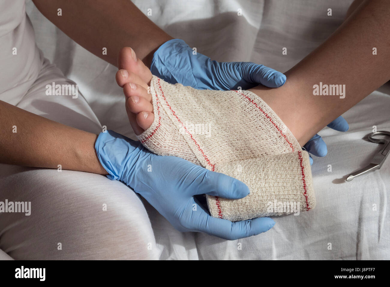 Close-up Of A Nurse Tying Bandage On Patient's Foot Stock Photo - Alamy
