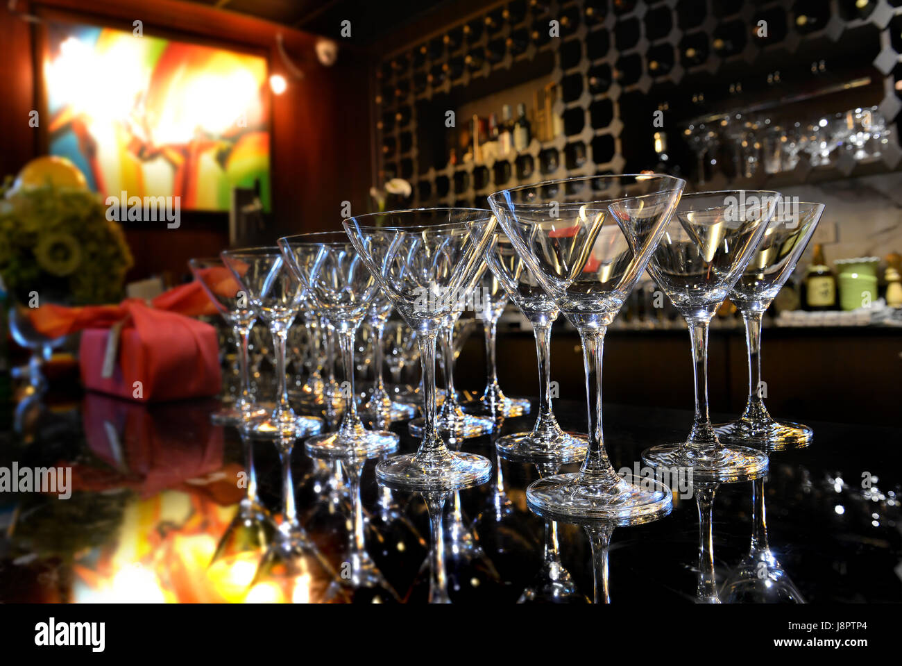 Empty cocktail or champagne glass arrange on the bar table photo in low ...