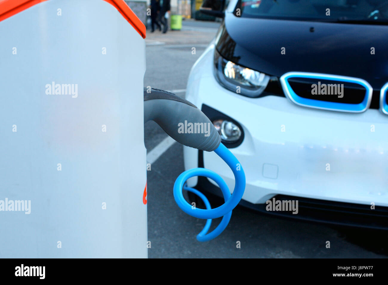 Loading energy of an electric car Stock Photo - Alamy