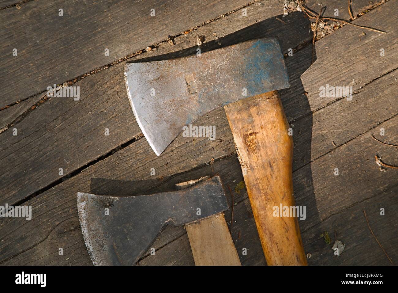Two Axes on the ground Stock Photo - Alamy