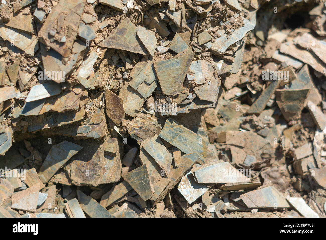 Close up of splintered / shaptered slate-type rock. For fall on stony ...