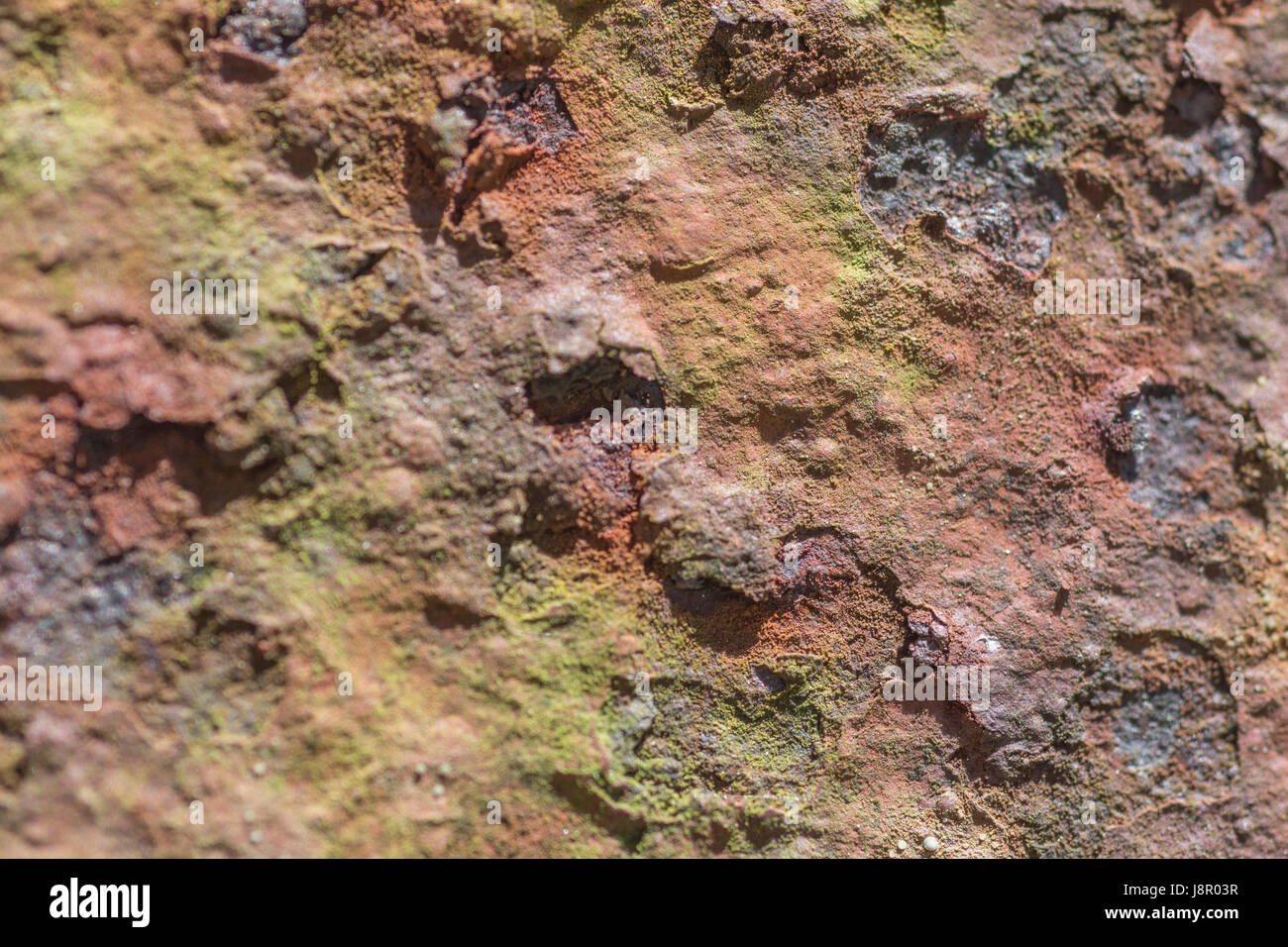 Corroding and rusting surface of an iron beam. Bumpy surface texture ...