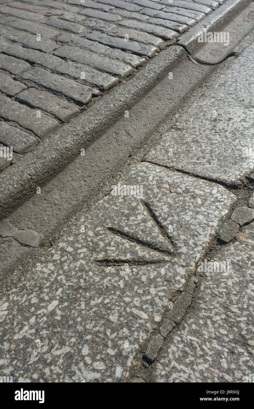 Traditional kerbside surveying benchmark reference point. Visual ...