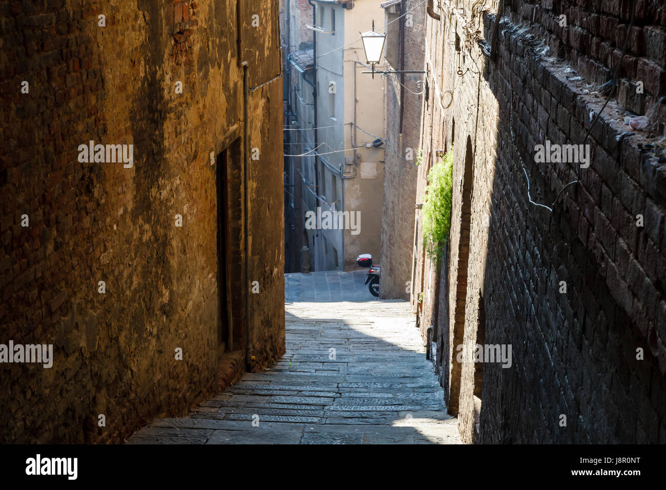 Narrow Alley With Old Buildings In Medieval Town of Siena, Tuscany ...