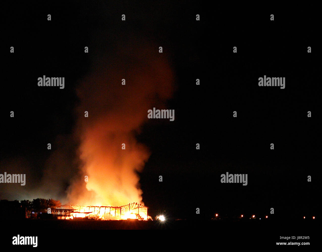 A raging fire destroys a house calapse in the night Stock Photo - Alamy