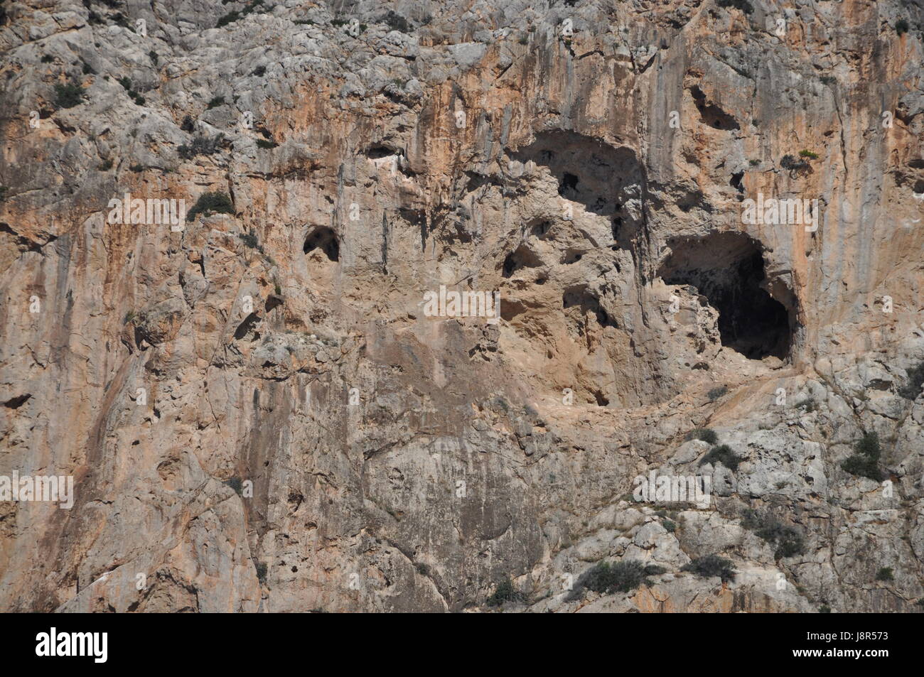 cave in a rock wall Stock Photo - Alamy