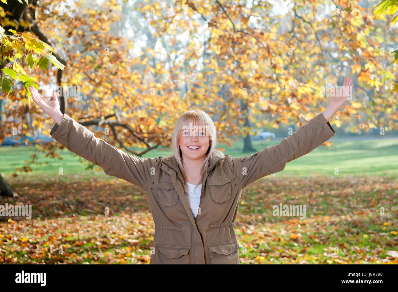 cheers young woman Stock Photo - Alamy