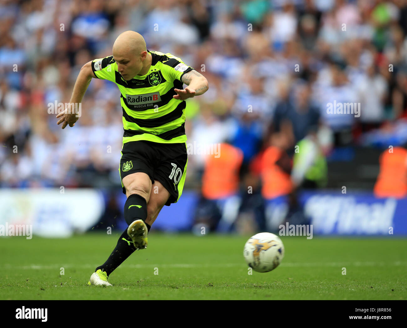 Huddersfield Town's Aaron Mooy scores from the penalty spot during the ...