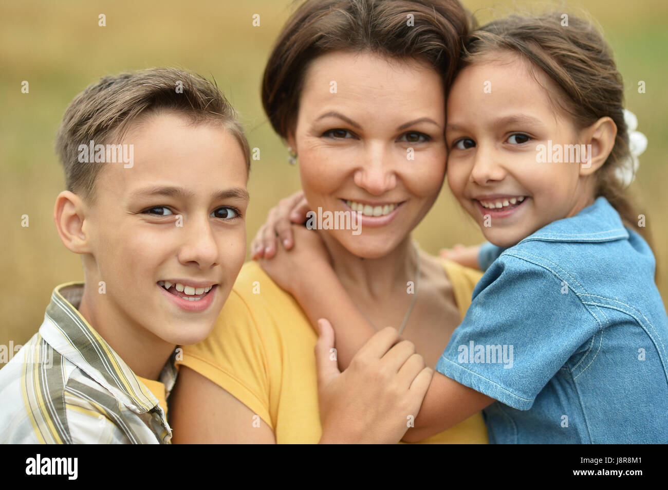 mother with children outdoors Stock Photo - Alamy