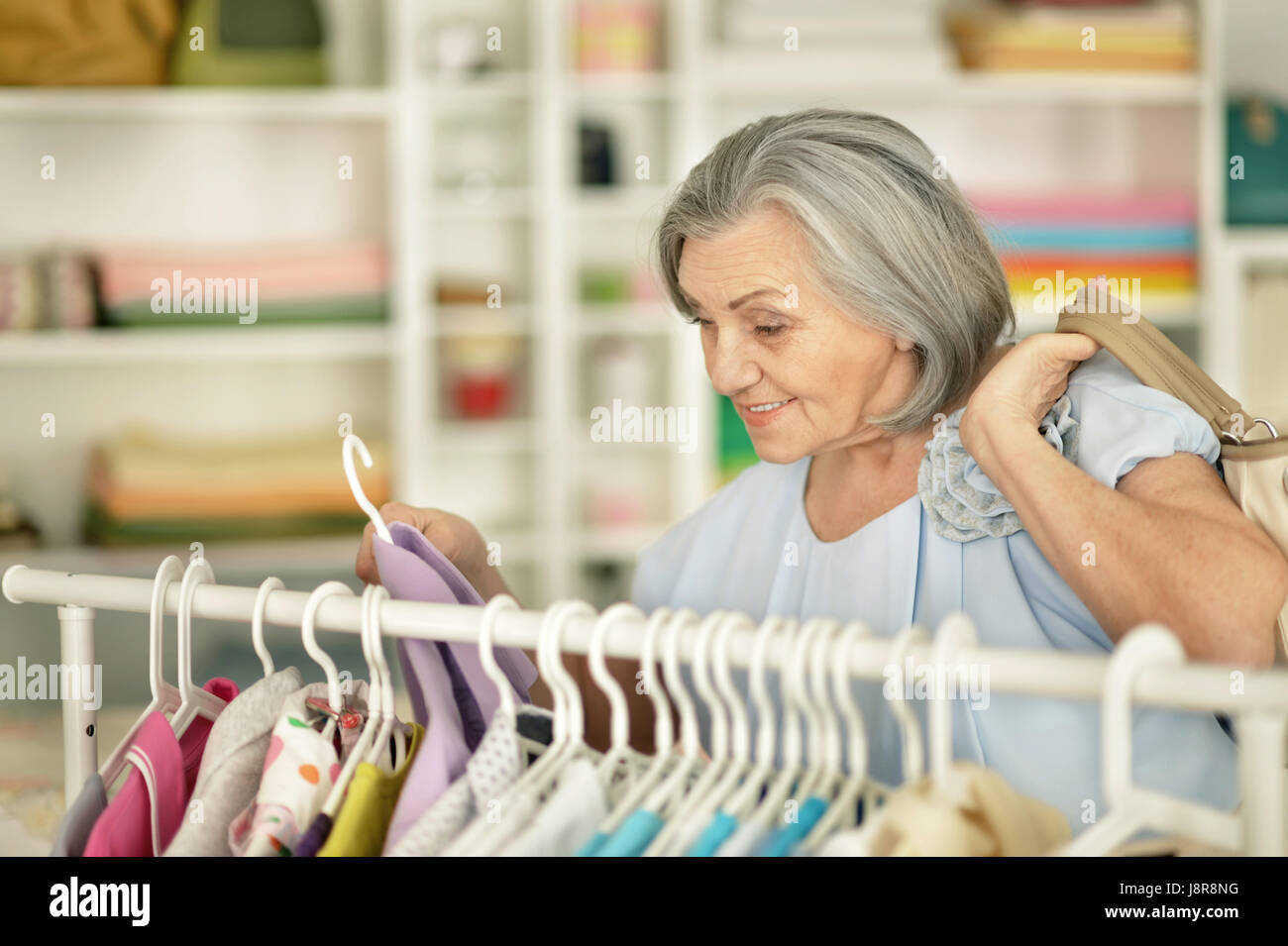Senior woman in shop Stock Photo - Alamy