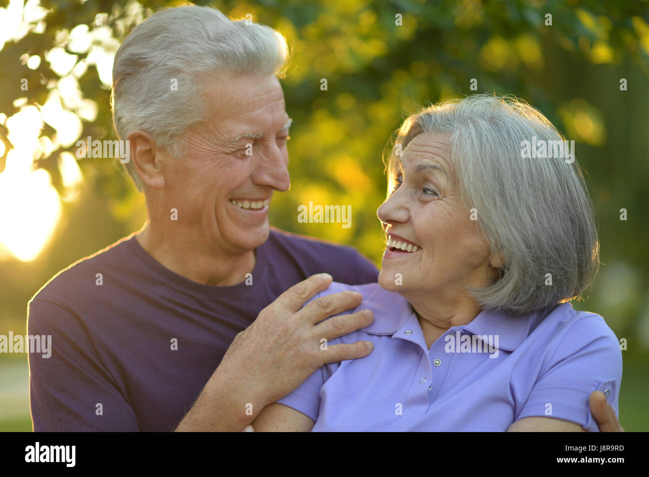 senior couple hugging Stock Photo - Alamy