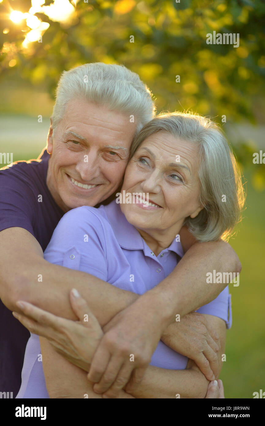 senior couple hugging Stock Photo - Alamy