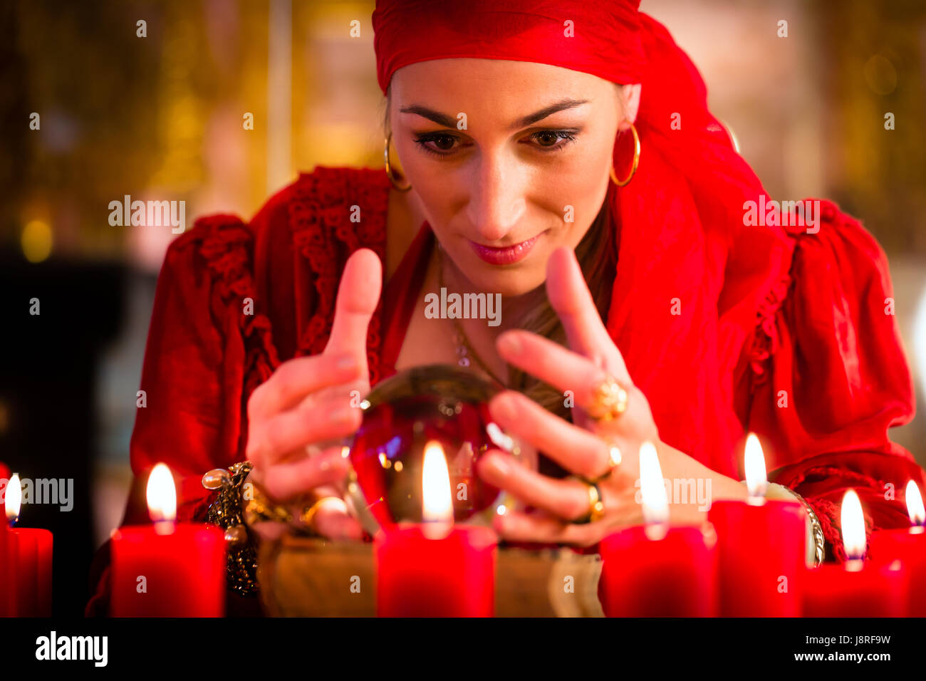 Soothsayer during session with Crystal ball Stock Photo - Alamy