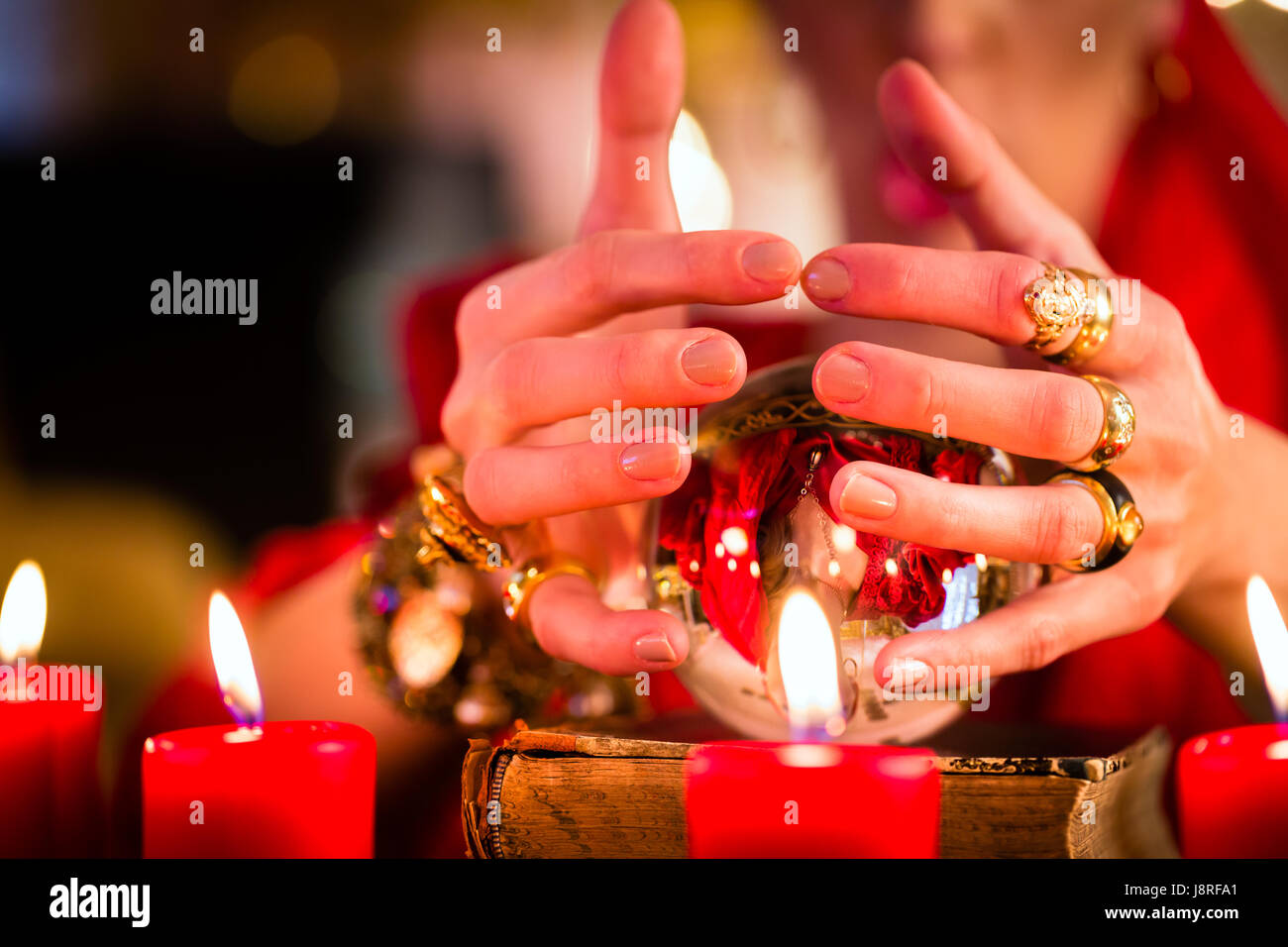 Soothsayer during session with Crystal ball Stock Photo - Alamy