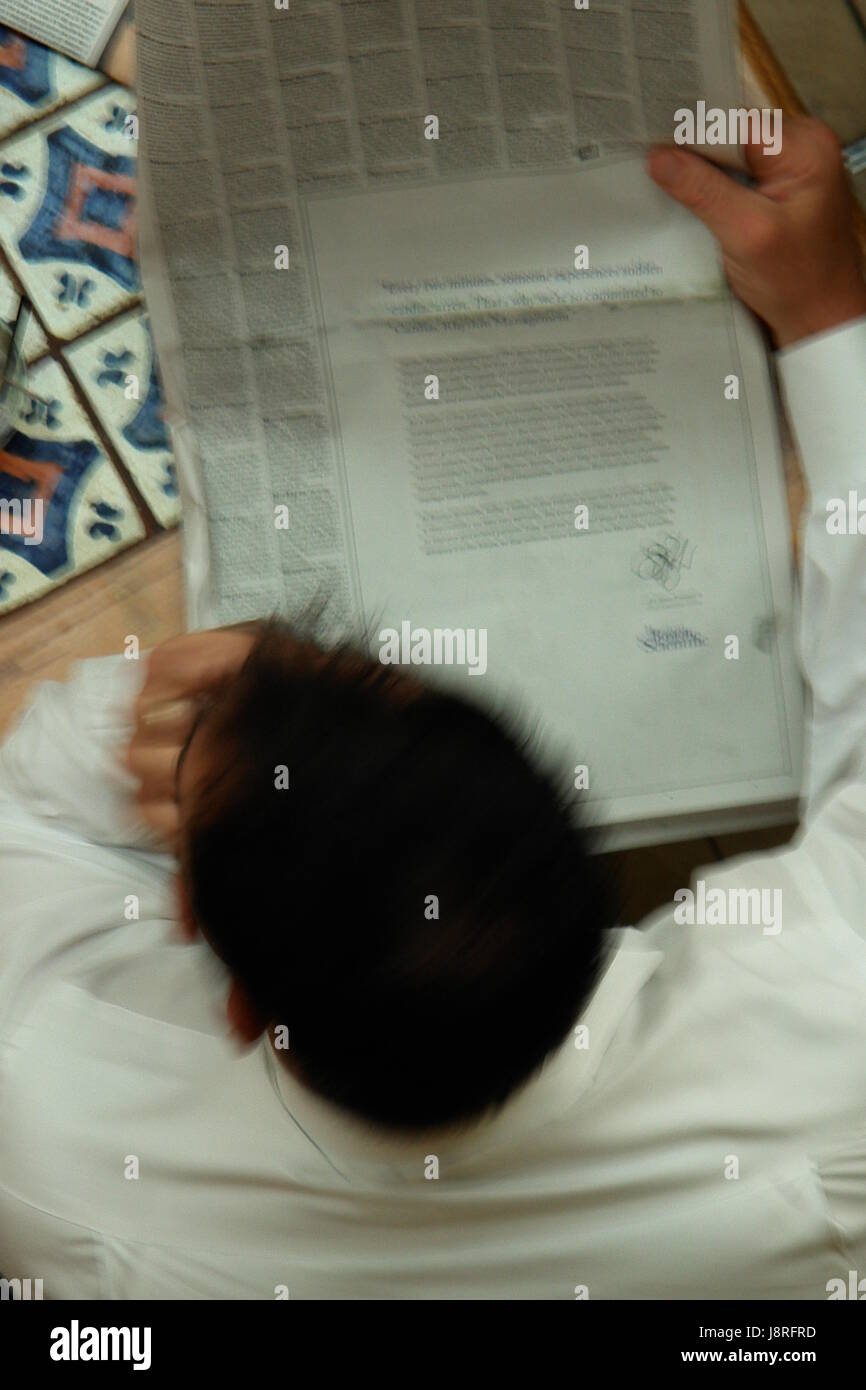 Man reading newspaper view from above Stock Photo - Alamy