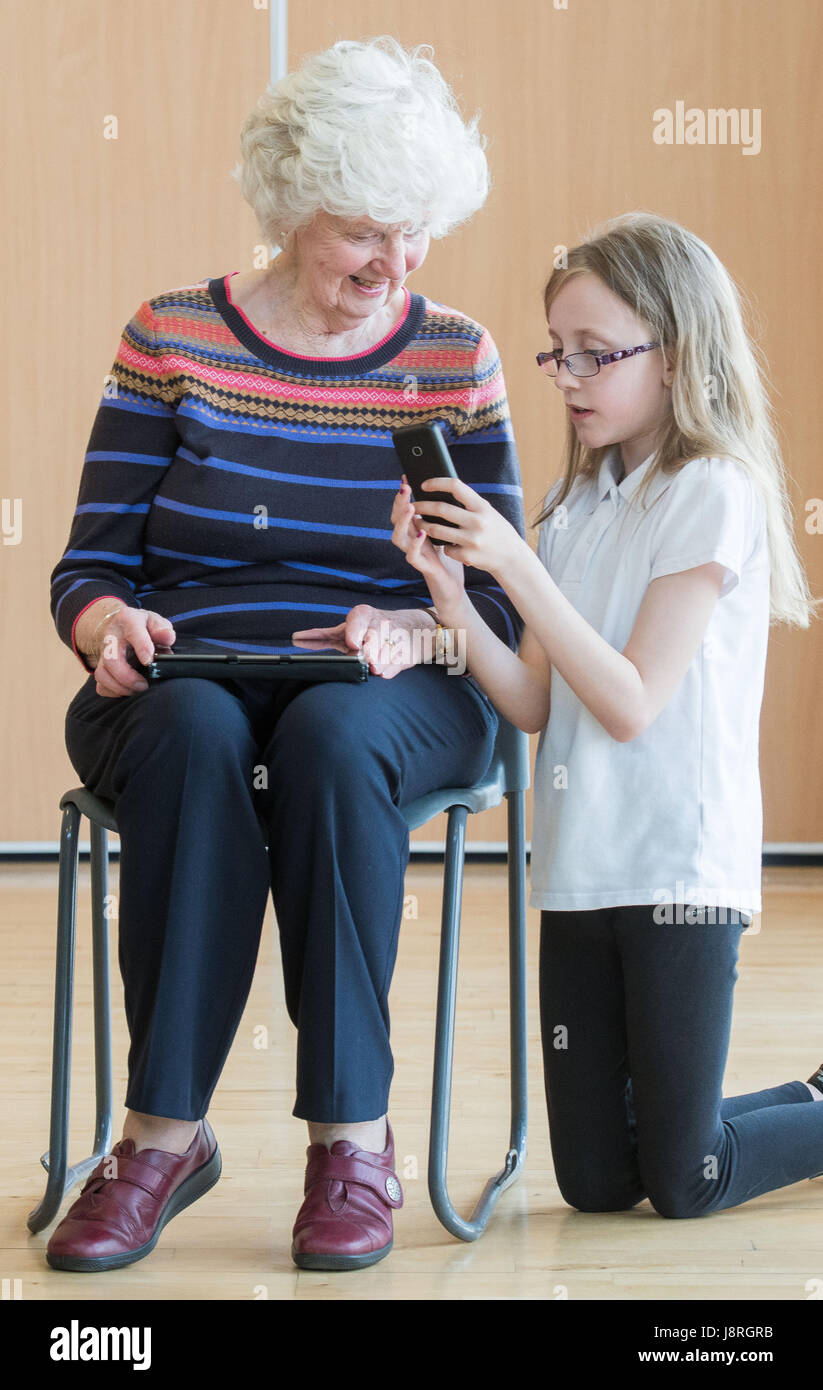 Picture: Moira Stephen 82 shown how to use a phone by Robyn Comrie ...