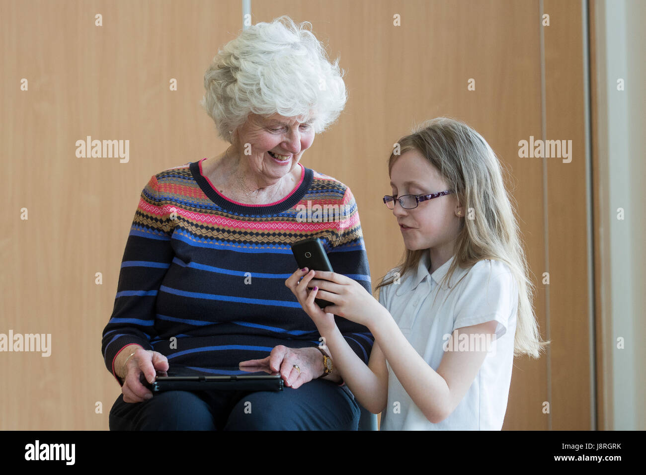 Picture: Moira Stephen 82 shown how to use a phone by Robyn Comrie ...