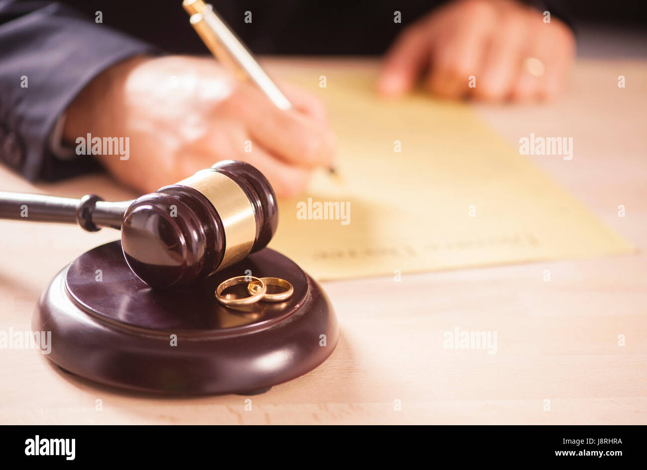 Judge with gavel on table Stock Photo - Alamy
