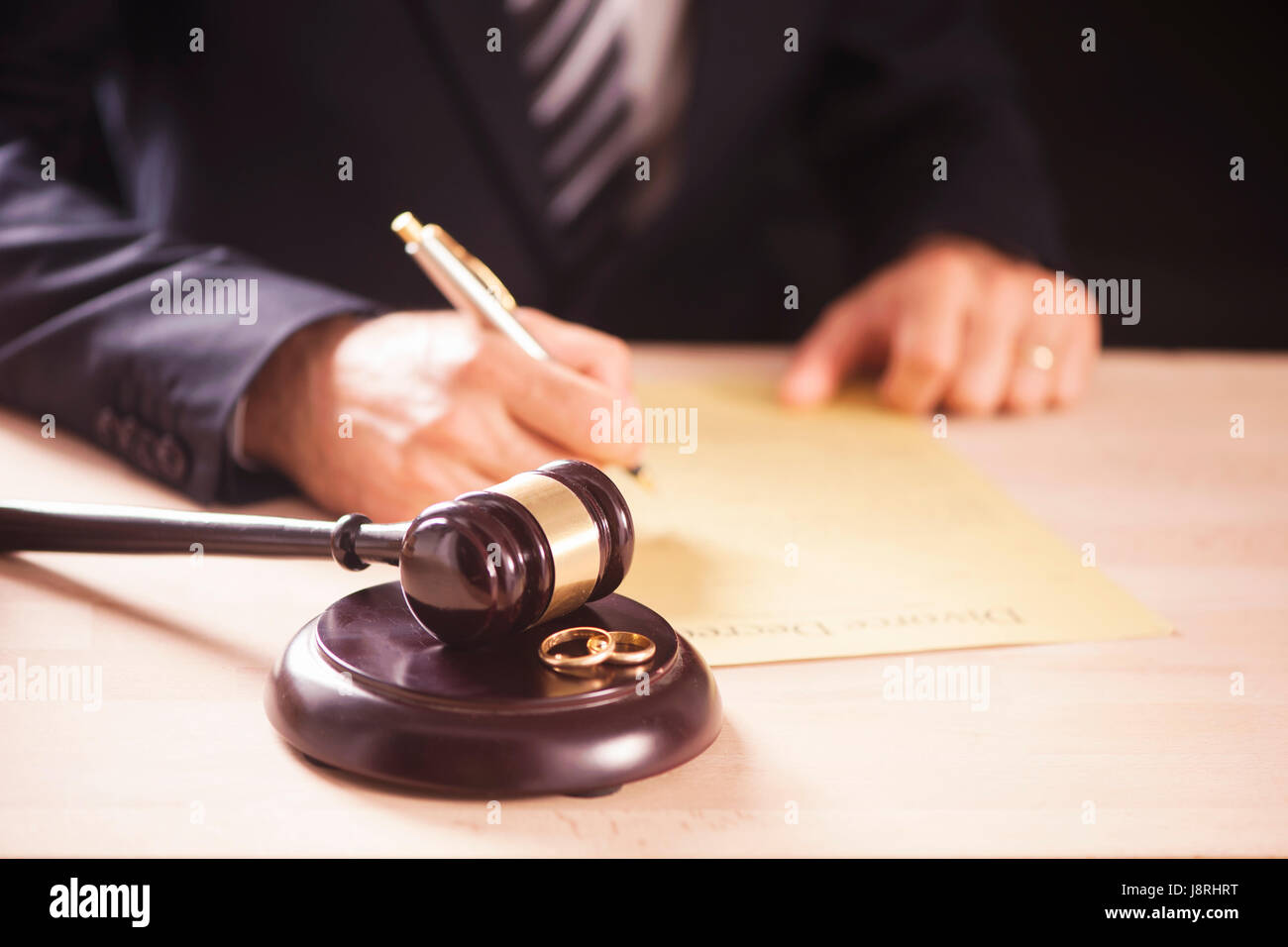 Judge with gavel on table Stock Photo - Alamy