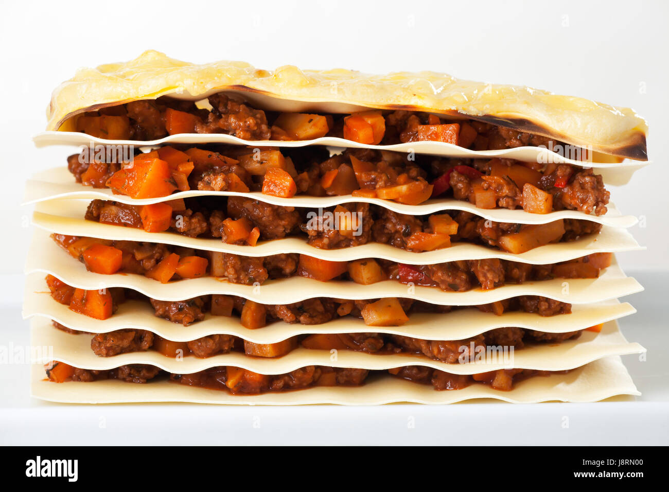 lasagna plates with sauce Stock Photo - Alamy