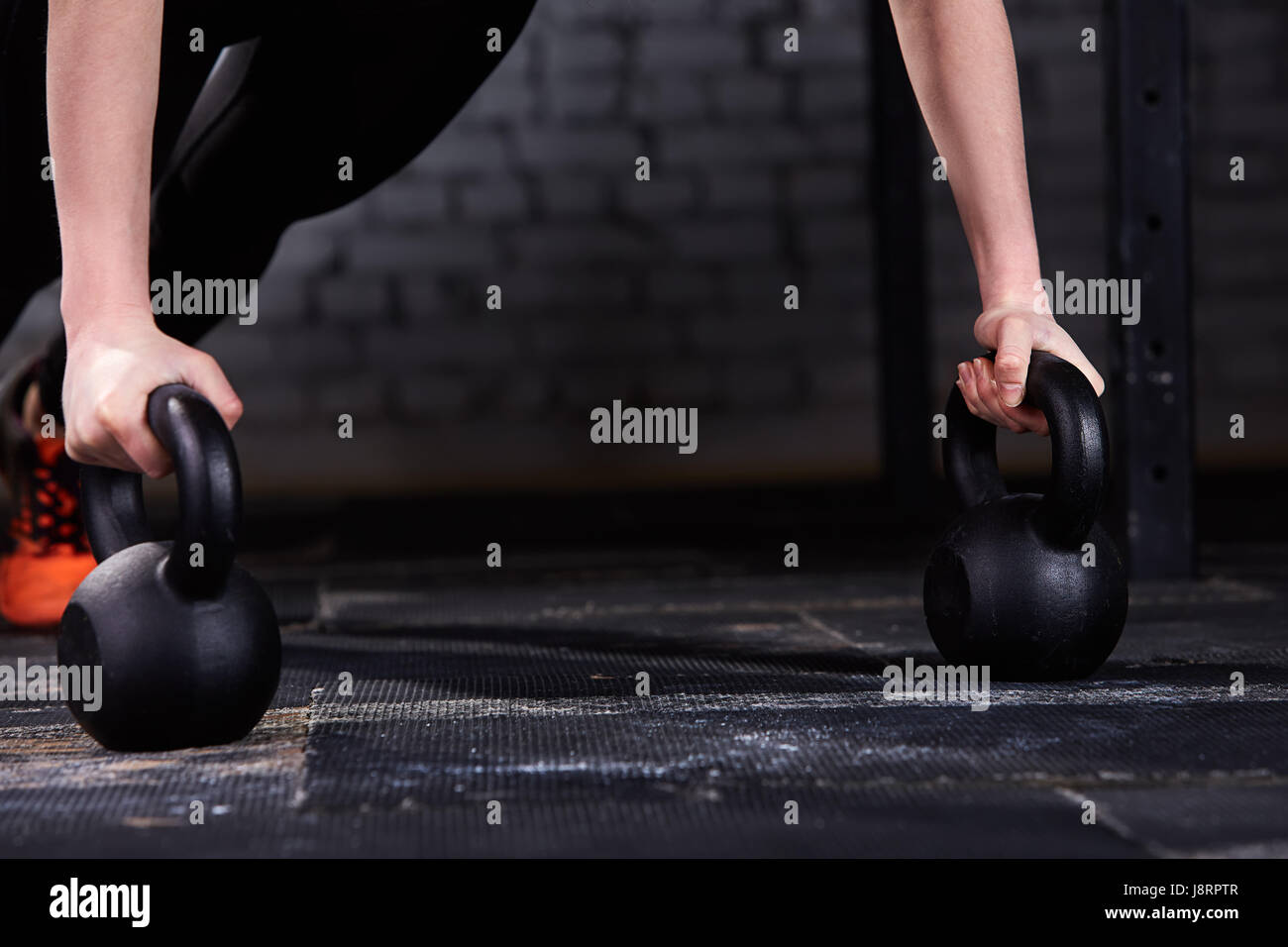 Close-up photo of young athlete woman's hands while doing push ups on ...