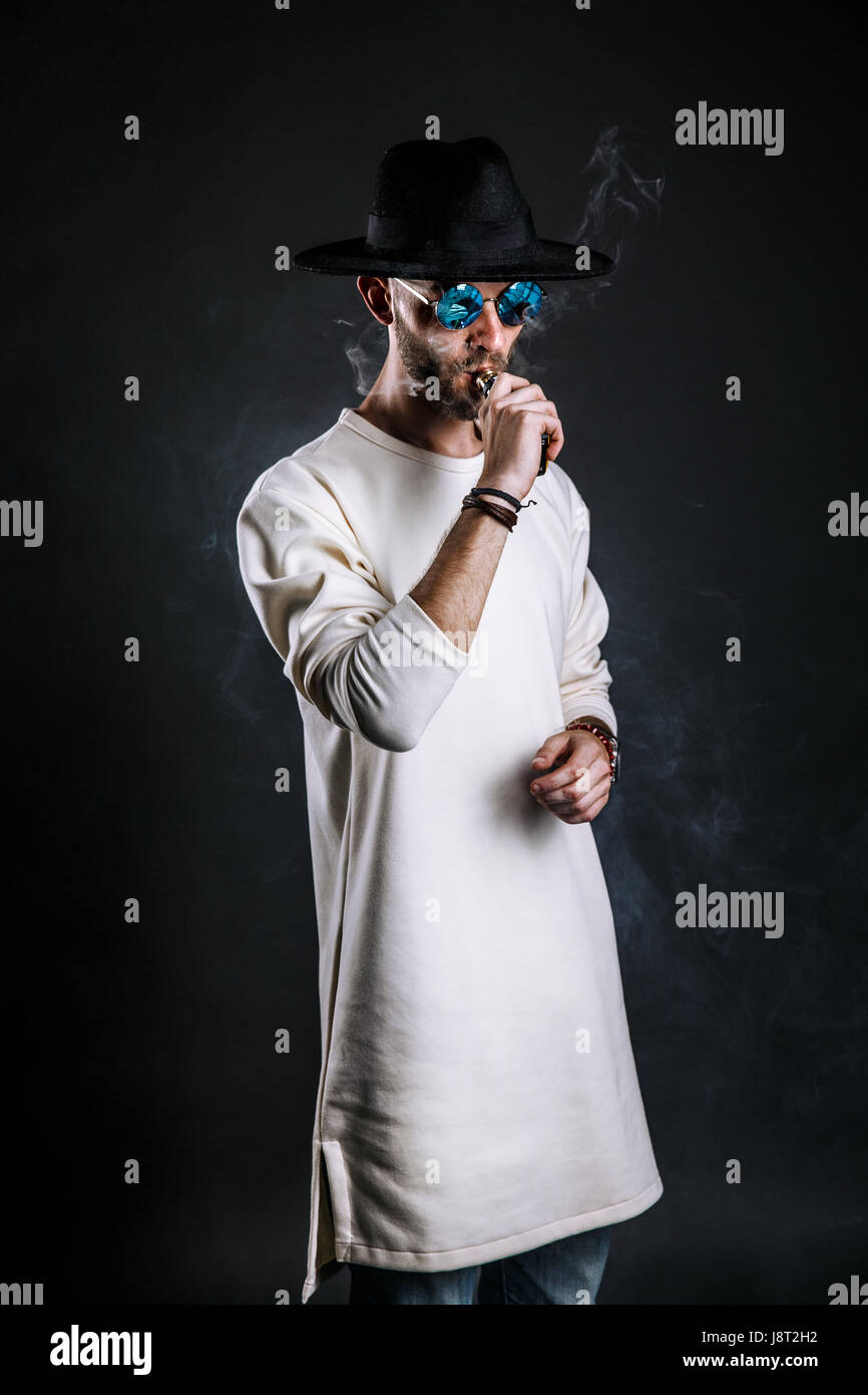 Attractive man hat cigarette hi-res stock photography and images - Alamy