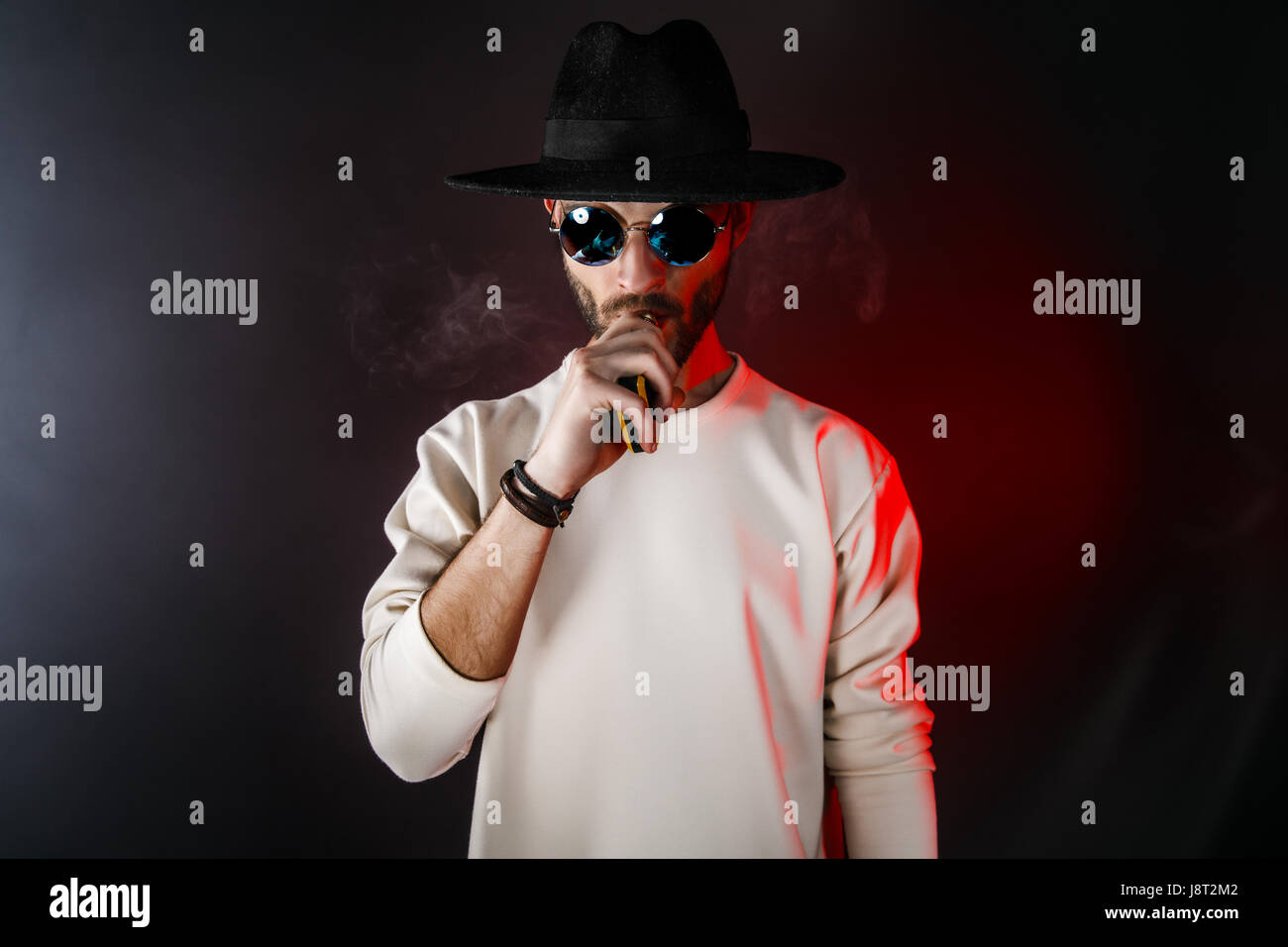 Stylish Man with vape Stock Photo - Alamy
