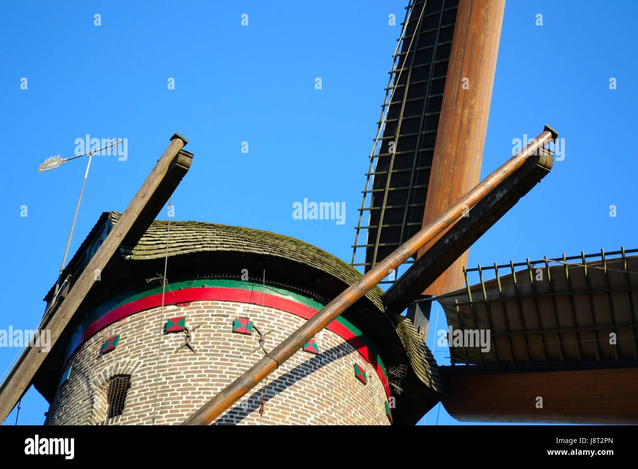 old windmill with taut sails Stock Photo - Alamy
