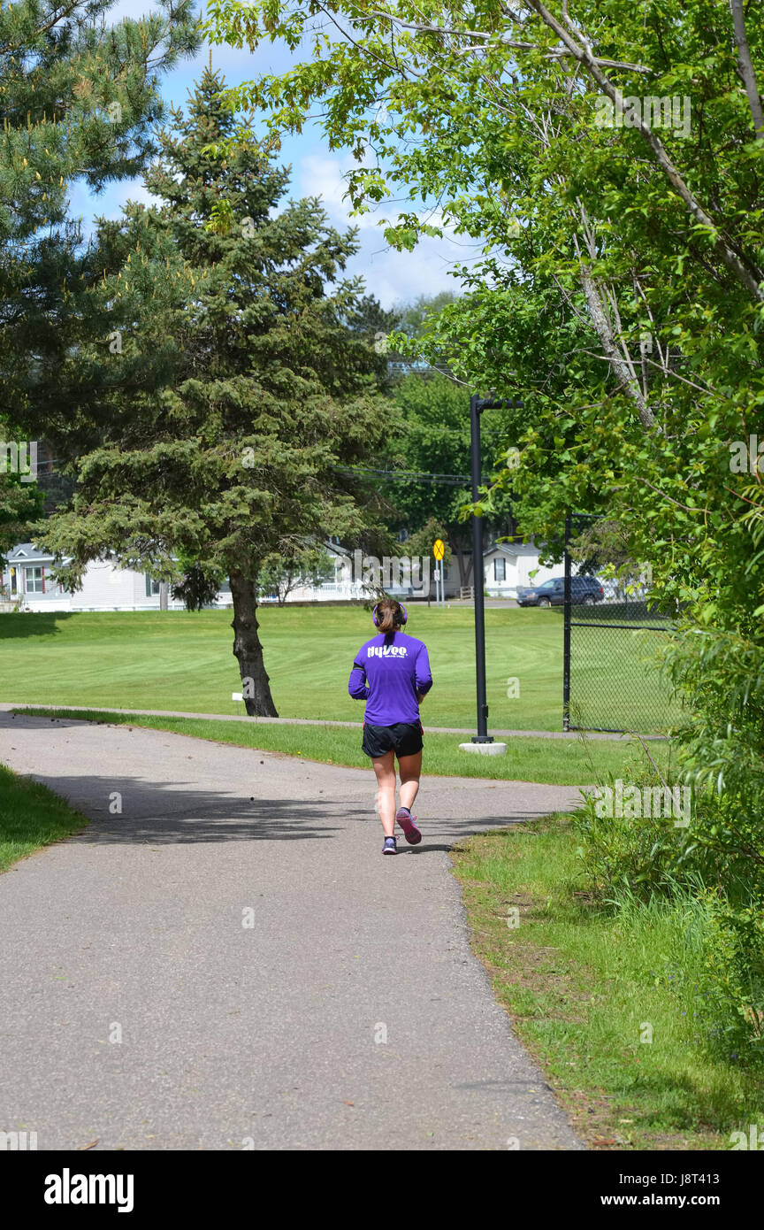 Female runner at the park Stock Photo - Alamy