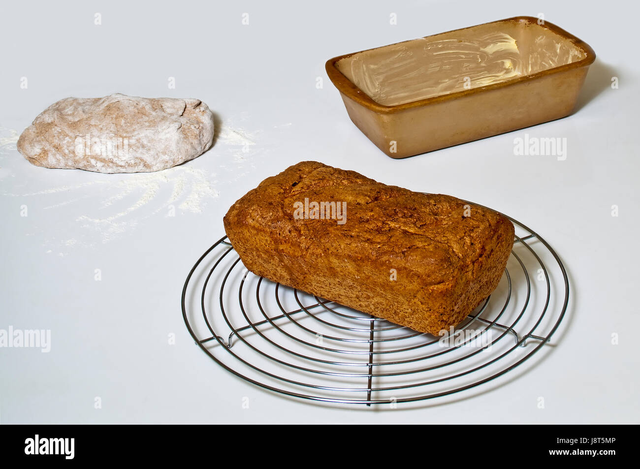 wholemeal bread dough and baking mold Stock Photo - Alamy
