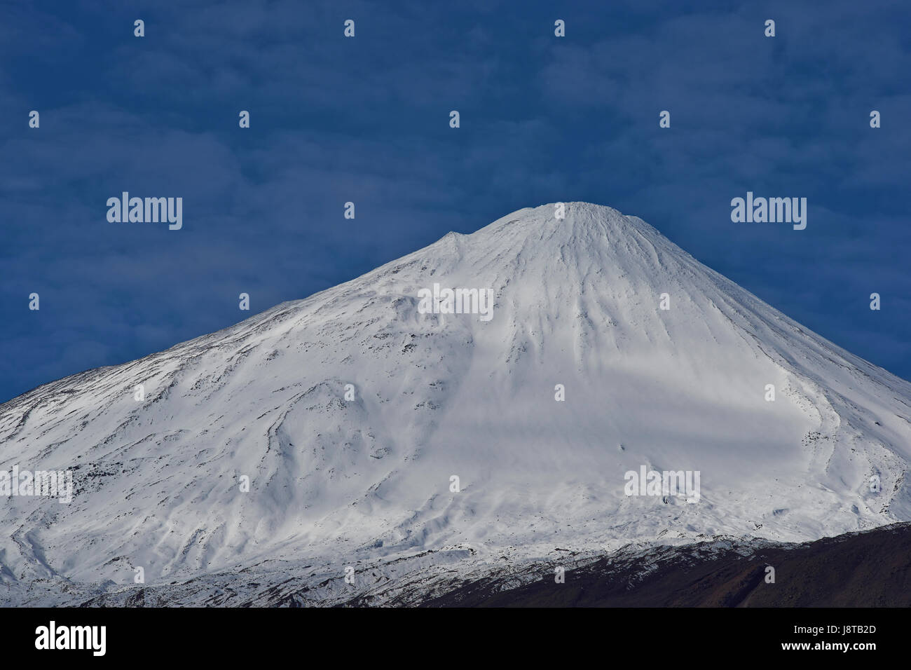 Snow capped peak of Antuco Volcano (2,979 metres) in Laguna de Laja ...
