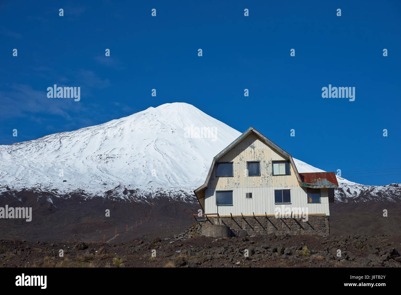 Snow capped peak of Antuco Volcano (2,979 metres) rising above the ...