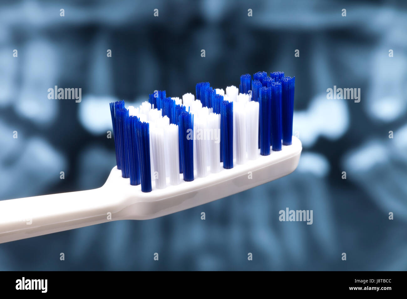 toothbrush in front of a damaged set of teeth Stock Photo - Alamy