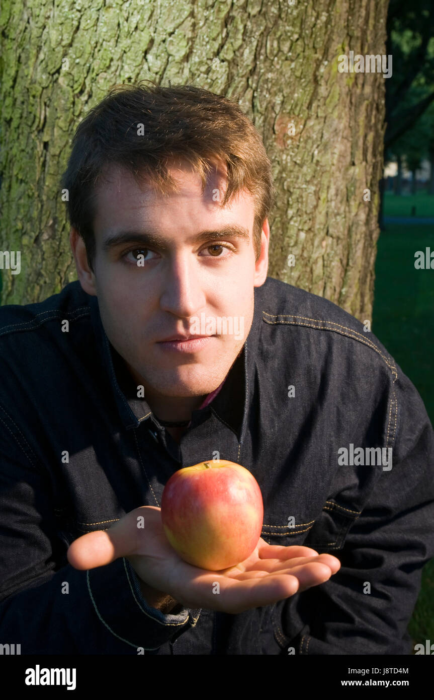 apple on the hand Stock Photo - Alamy