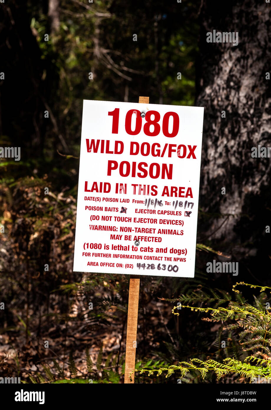 Warning - wild dog and fox poison sign Stock Photo - Alamy