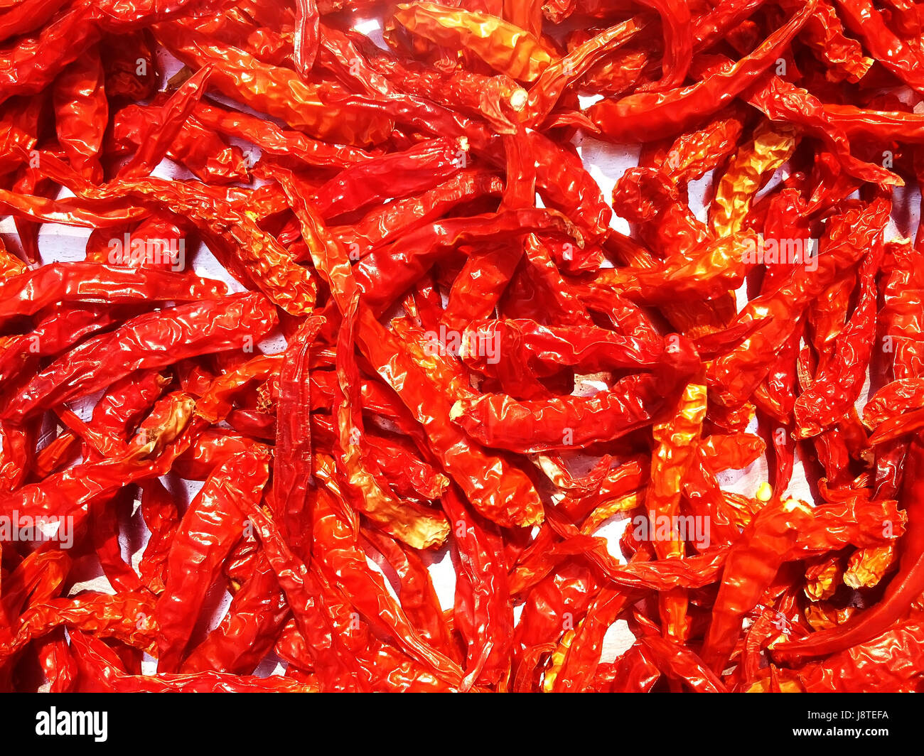 dried red chili as a texture food background Stock Photo - Alamy