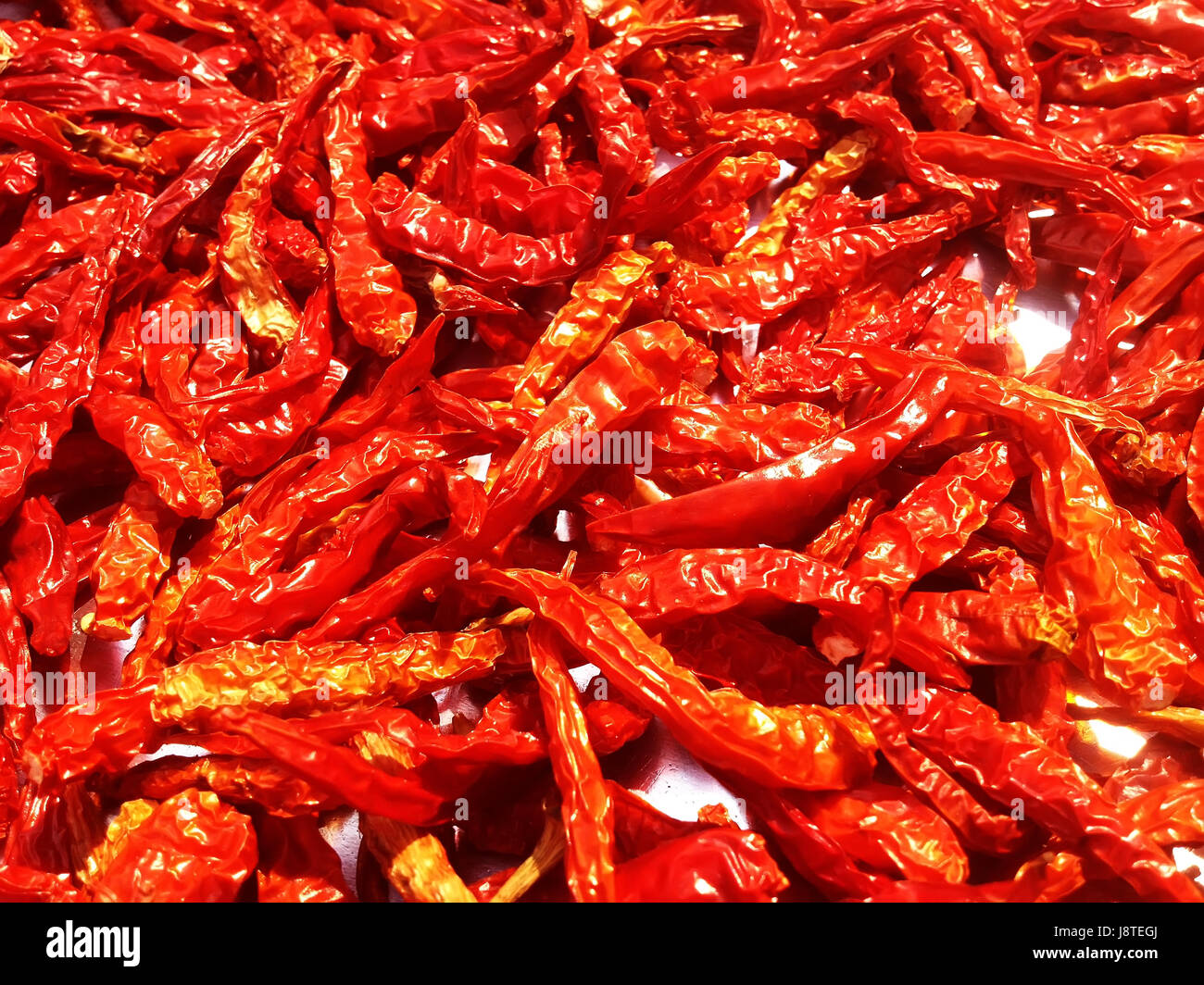 dried red chili as a texture food background Stock Photo - Alamy
