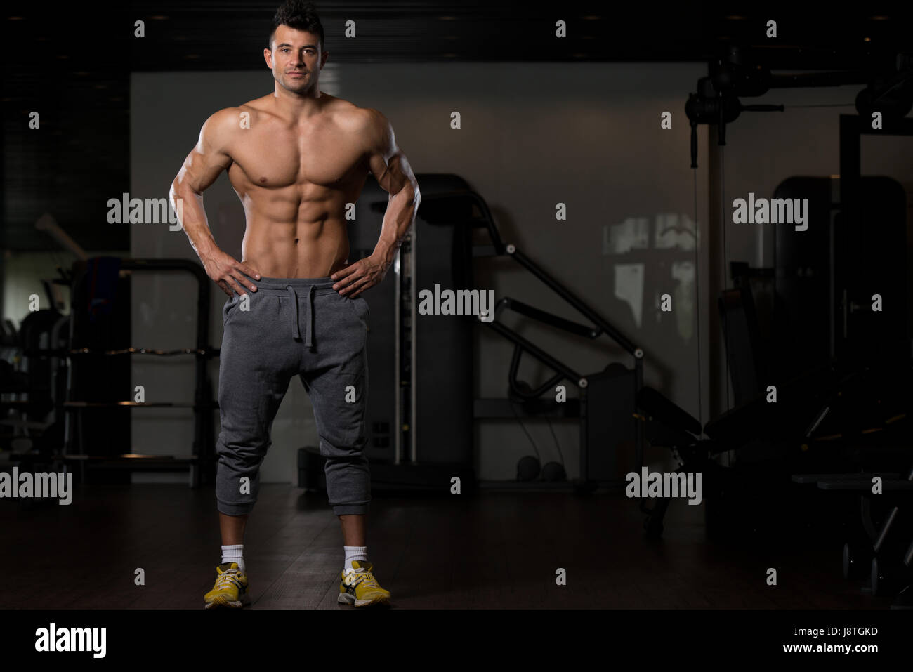 Portrait Of A Young Physically Fit Man Showing His Well Trained Body ...
